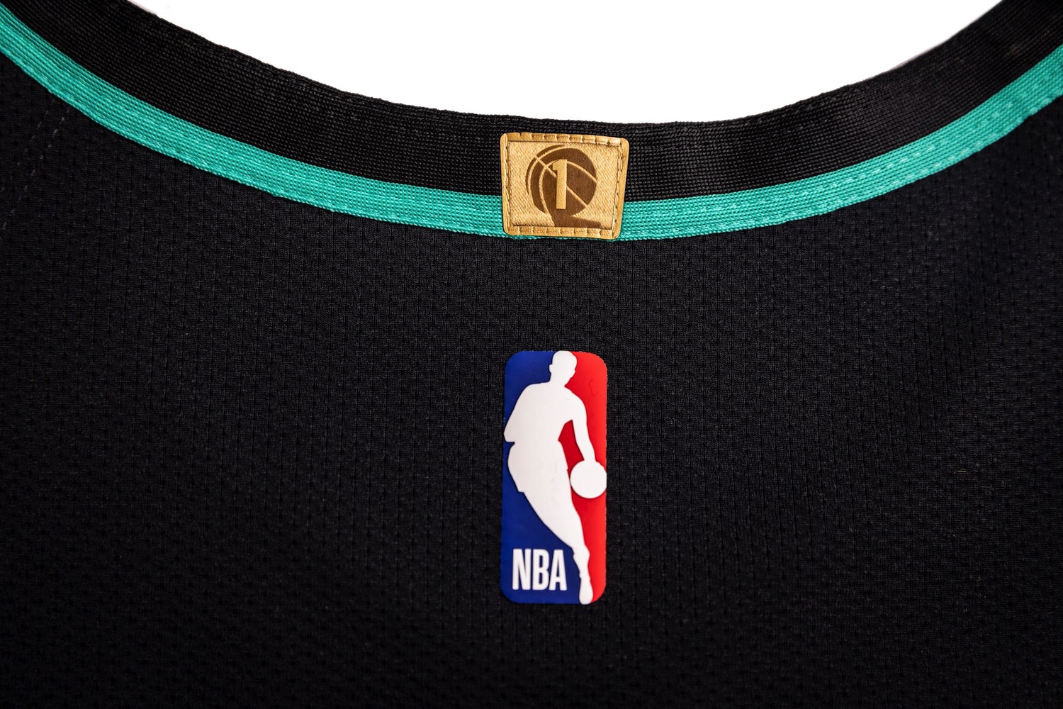 The gold trophy icon on the back neck symbolizes the team's 1977 ...